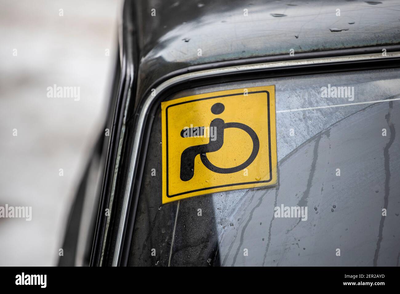 disabled sign pasted on the rear window of the car. High quality photo ...