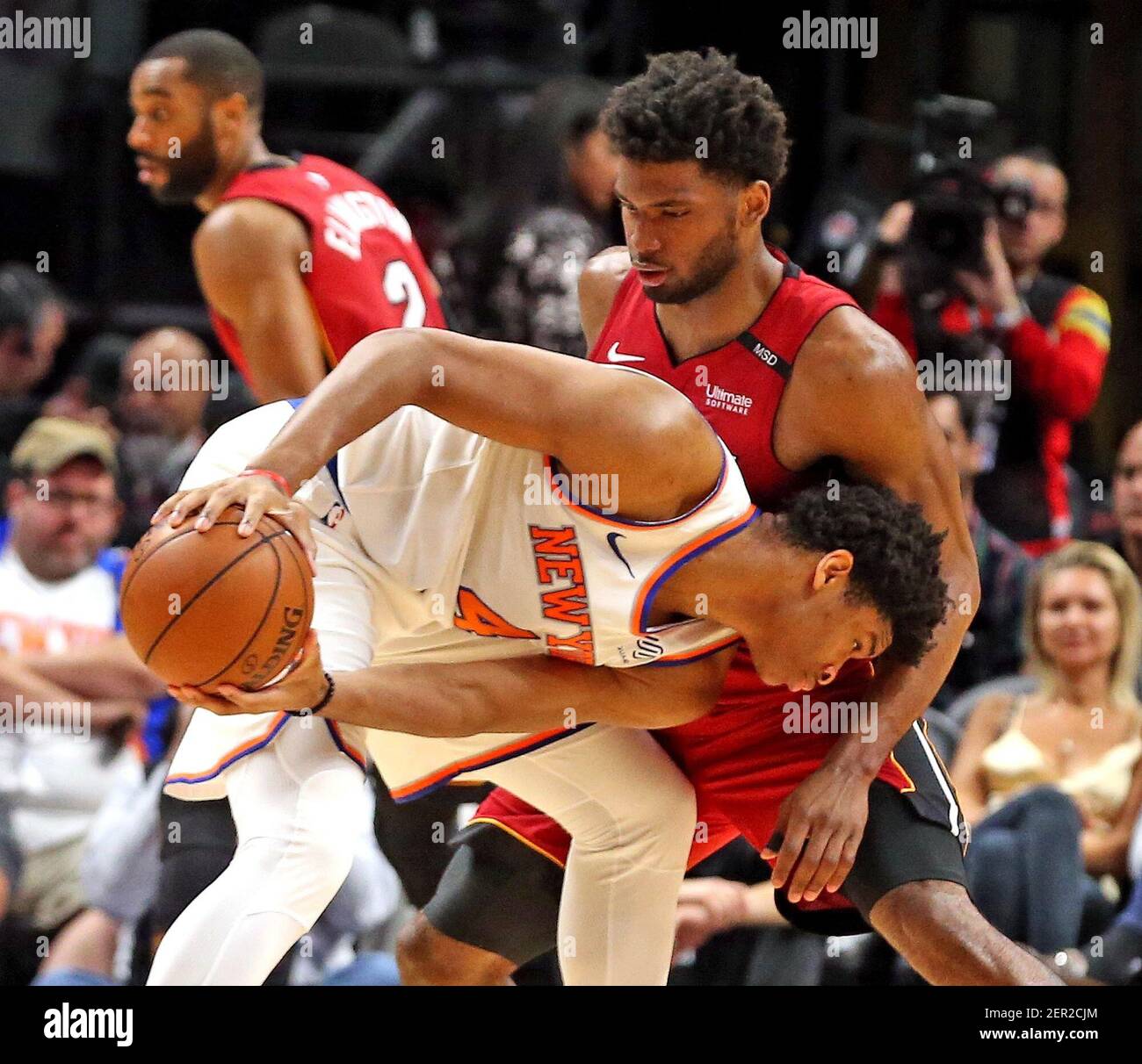 The New York Knicks' Issiah Hicks drives into the Miami Heat's Justise ...