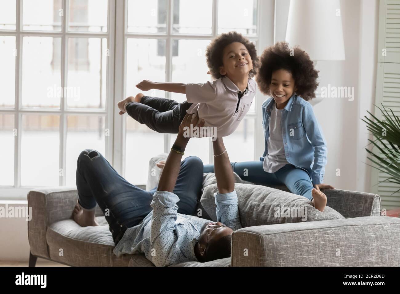 African American father playing funny active sport games Stock Photo ...