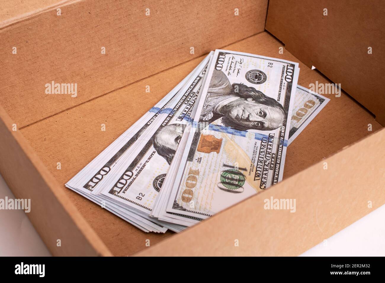 Heap dollars in box hi-res stock photography and images - Alamy