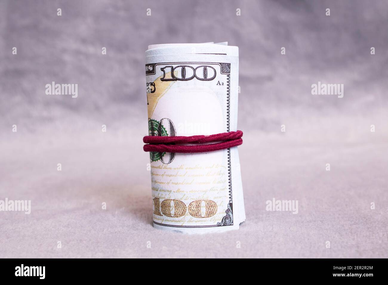 Bundle dollars on gray hi-res stock photography and images - Alamy