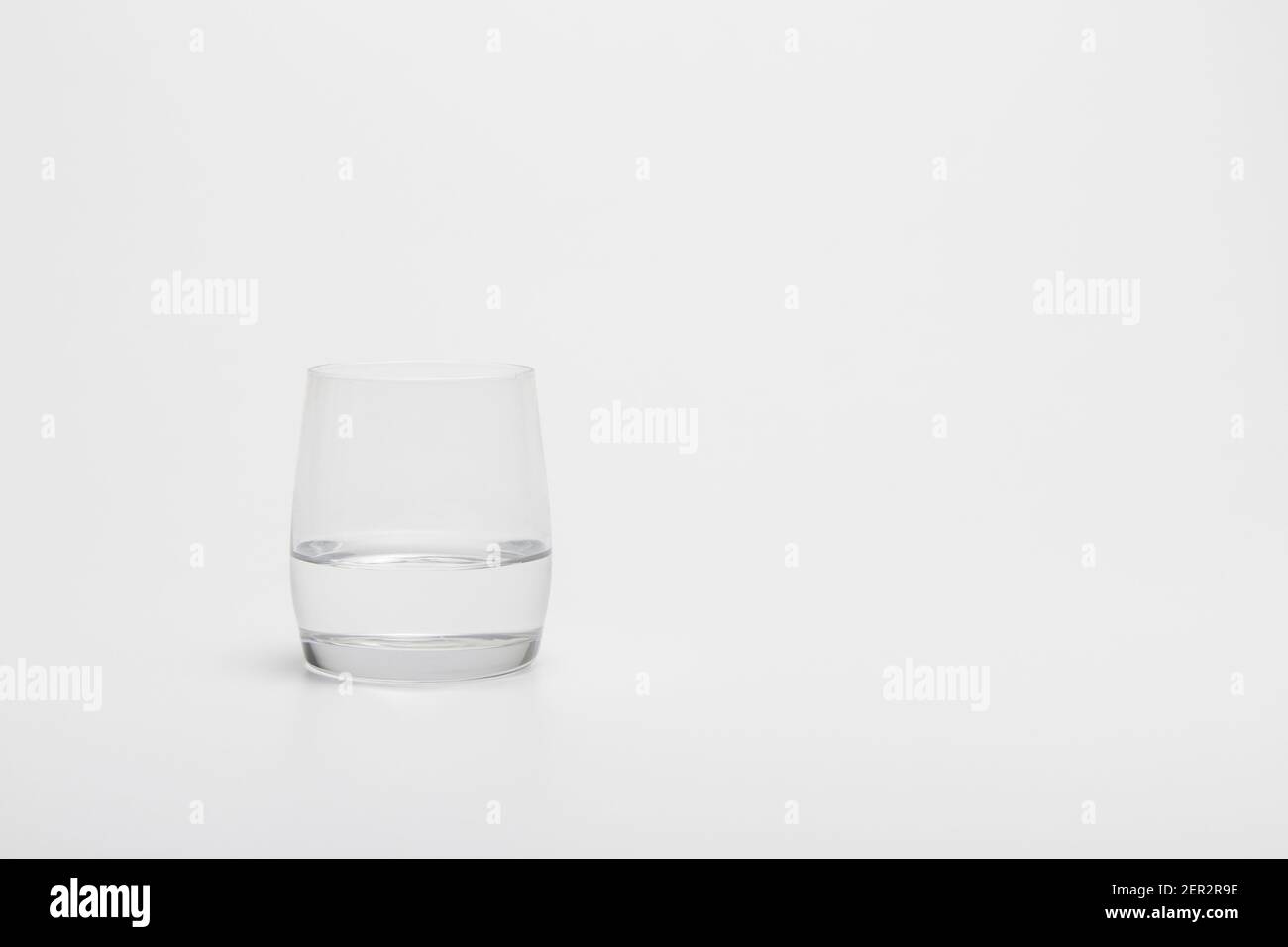 The Half Full Glass Of Pure Water Isolated On A White Background A Drinking Glass Half Filled