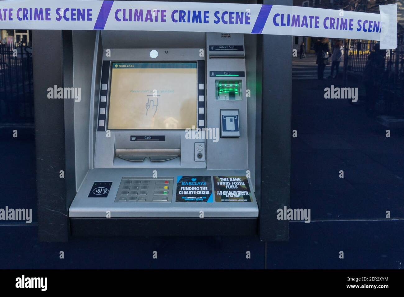 London, UK. 28th Feb, 2021. Climate activists target an ATM at the ...