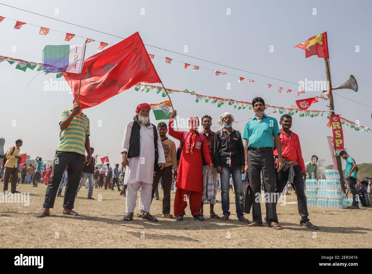 CPIM (Communist Party of India Marxist) party supporters waving flags ...