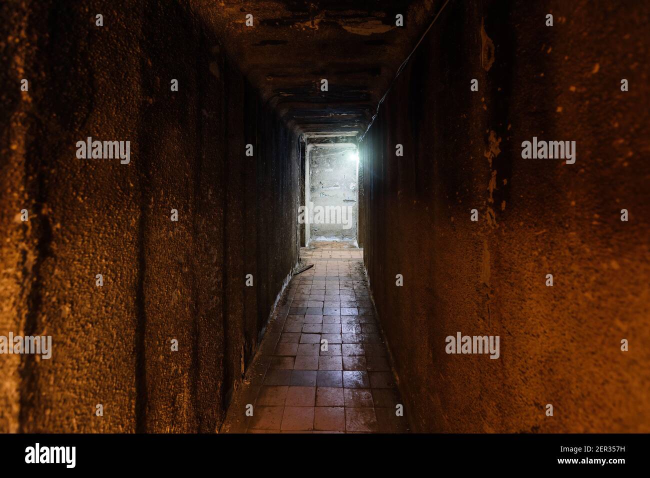 Dark corridor of old underground Soviet military bunker under artillery ...