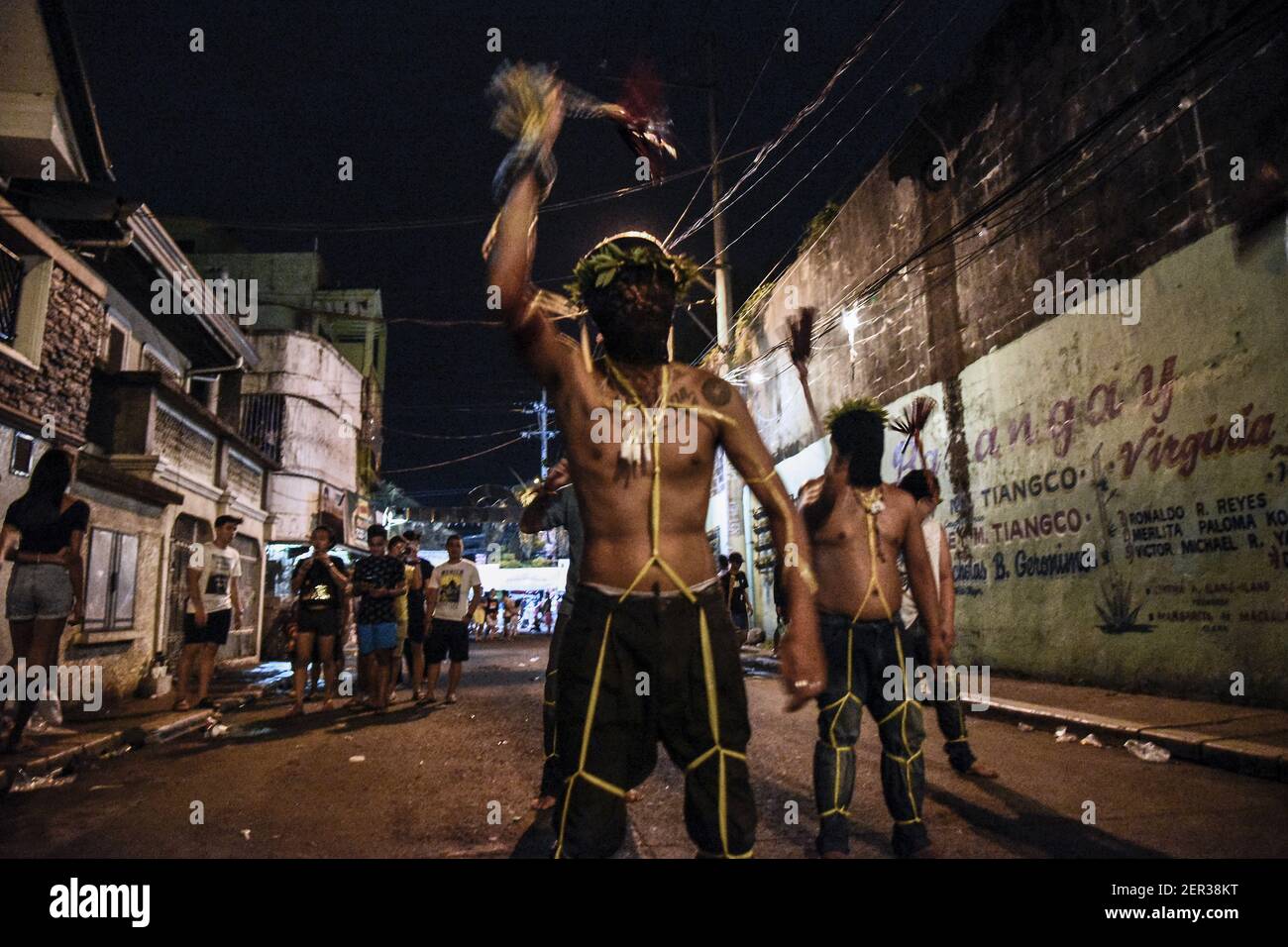 Masked flagellants with bloodied backs whip themselves during Good ...