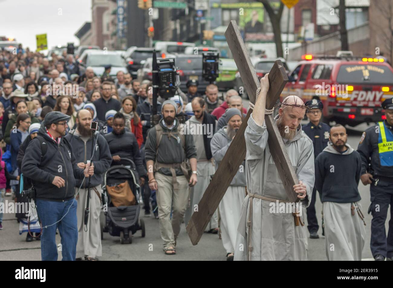 Parishioners and clergy members from the Franciscan Friars of the ...