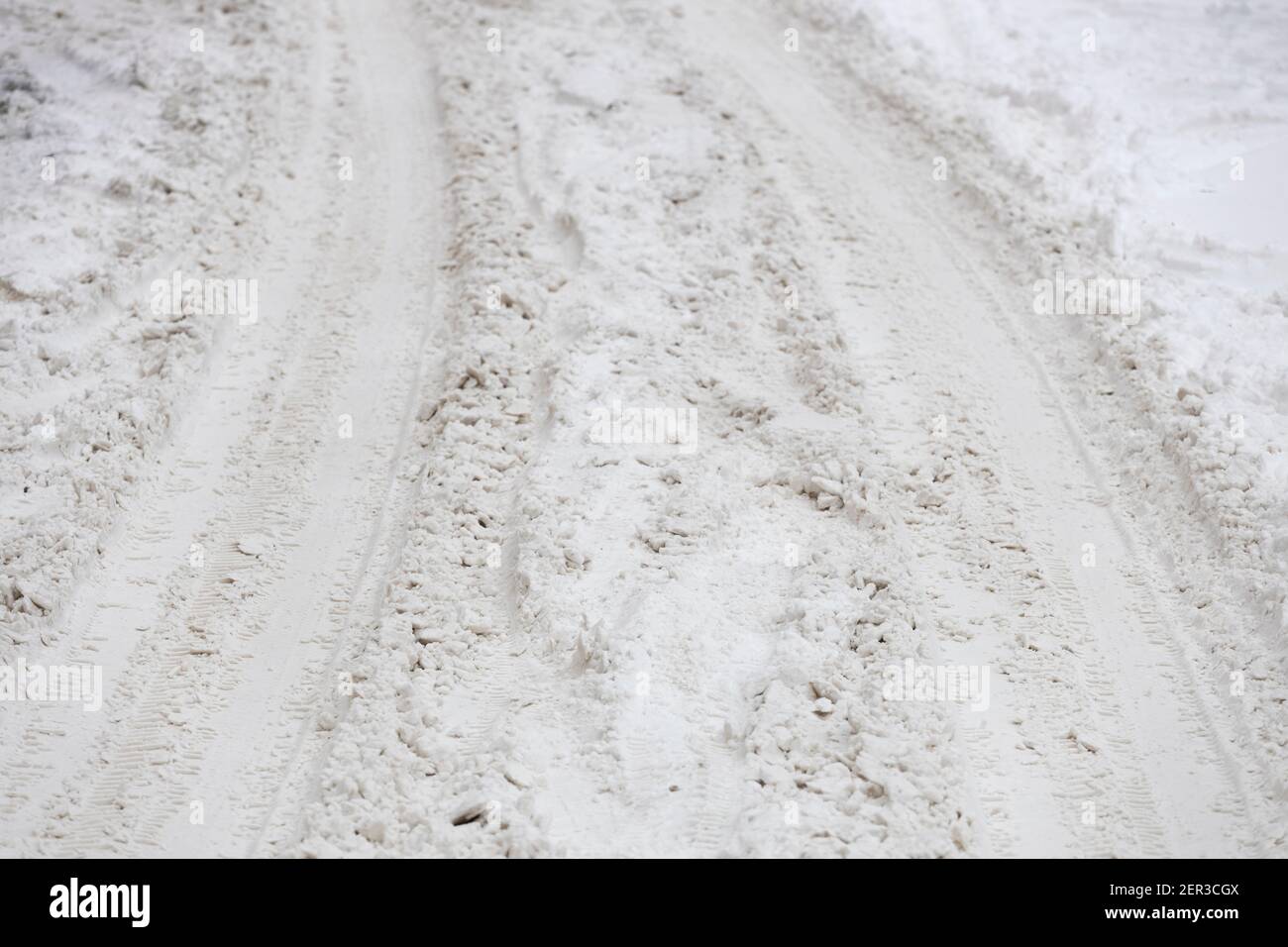 trail from car tires in the snow. uncollected winter road. High quality ...