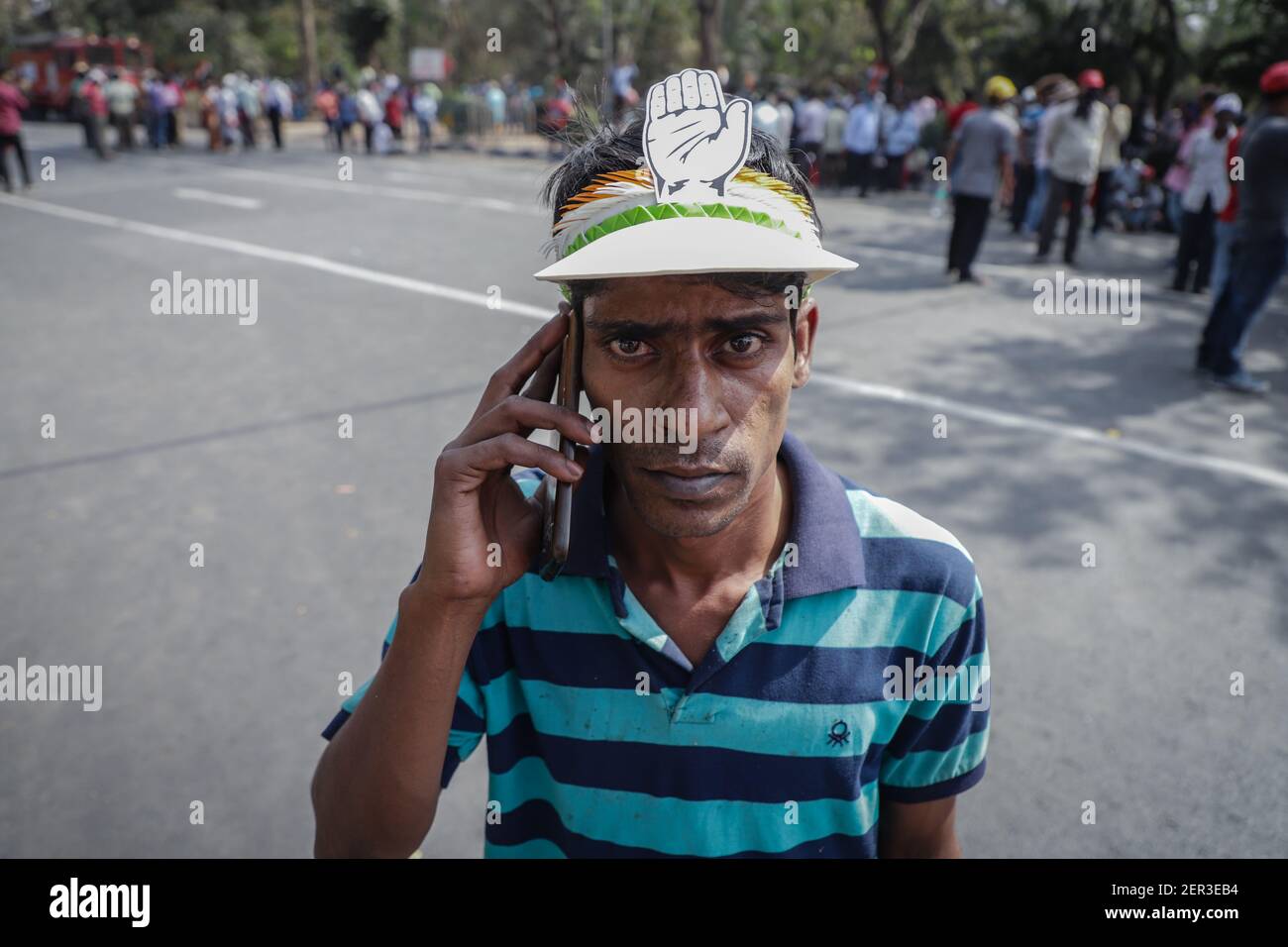 A congress party member wearing congress signed (Hand) cap during the ...