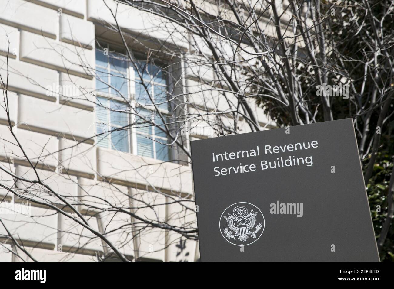A logo sign outside of the headquarters of the Internal Revenue Service ...