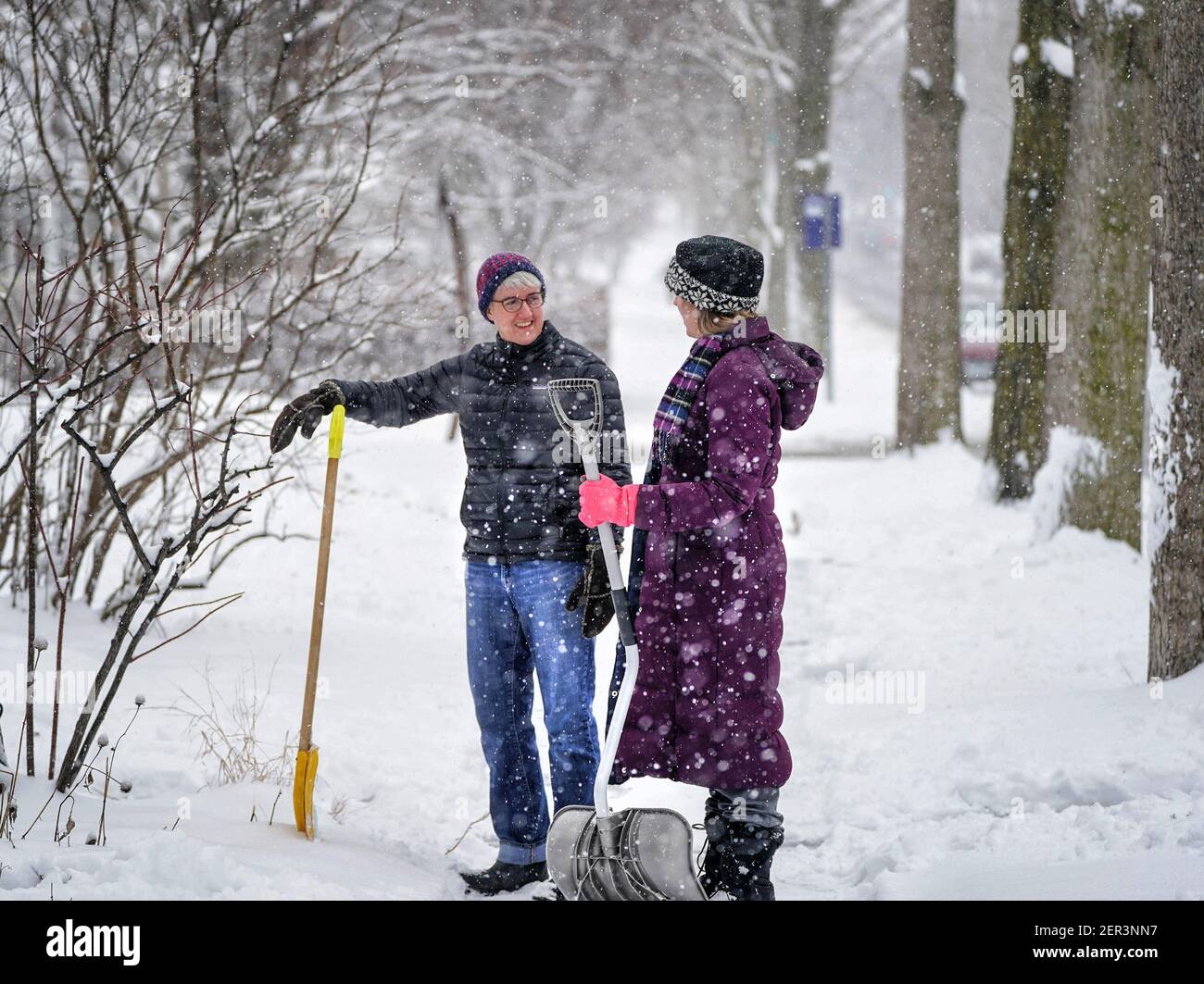 St. Paul neighbors Sharon Jansa and Kristina Youso visit as they clear ...