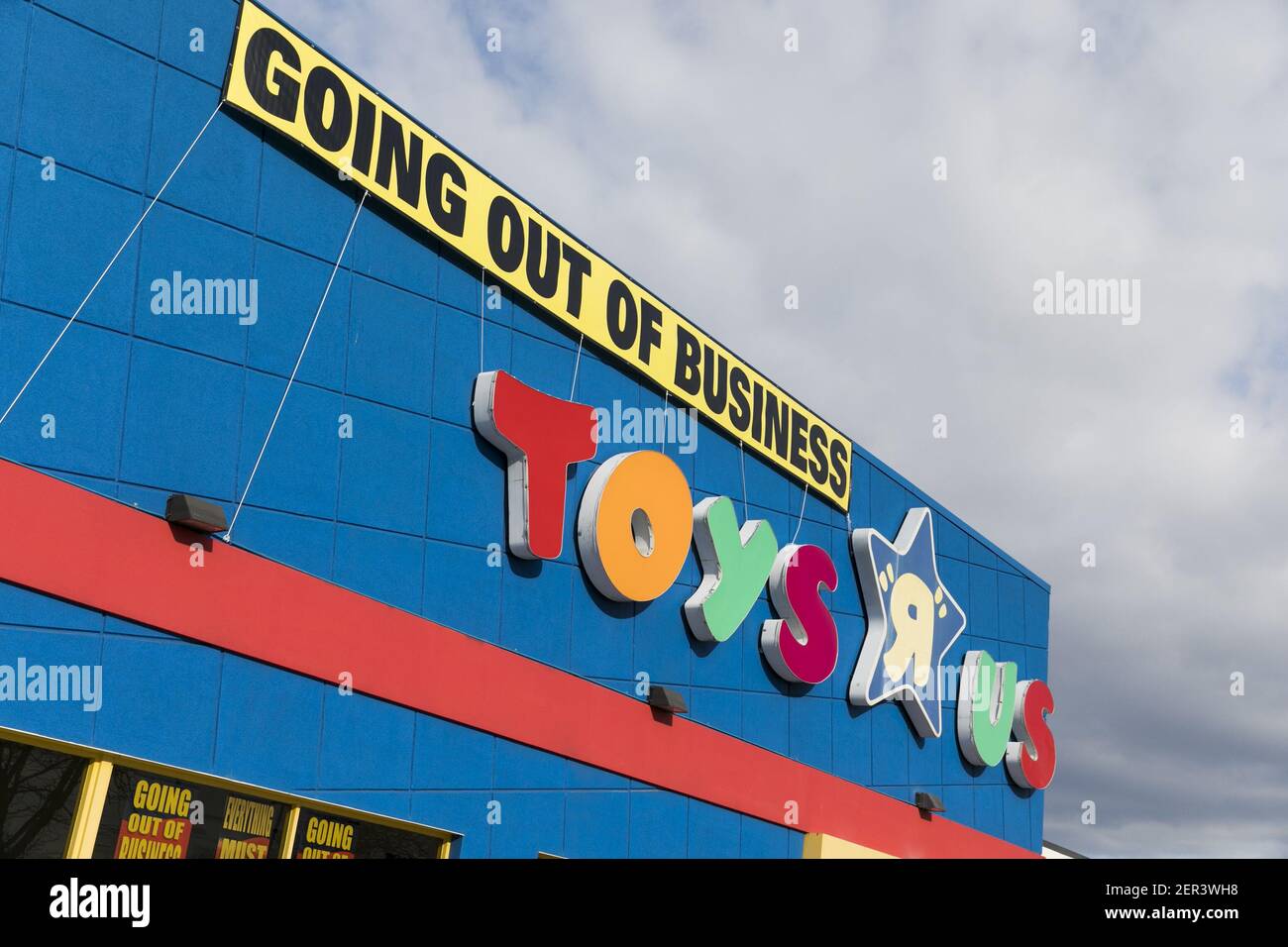 A logo sign outside of a Toys "R" Us retail store in Frederick ...
