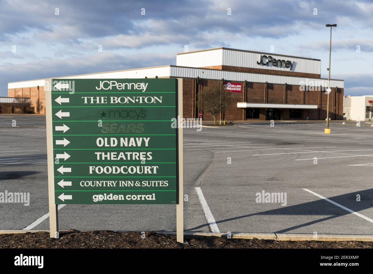 A shopping mall directional sign with the outlines of Sears and Macy's ...