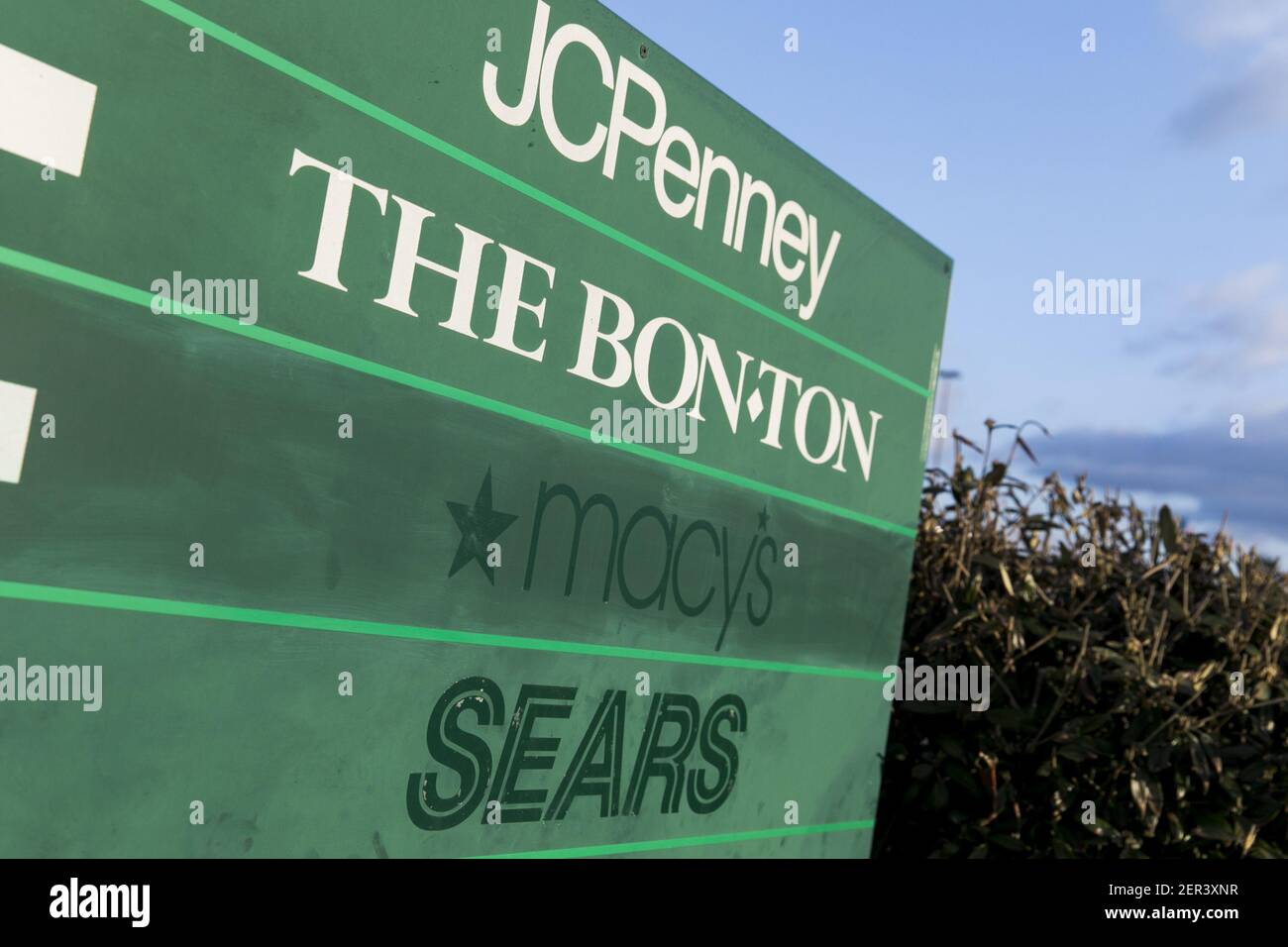 A shopping mall directional sign with the outlines of Sears and Macy's ...