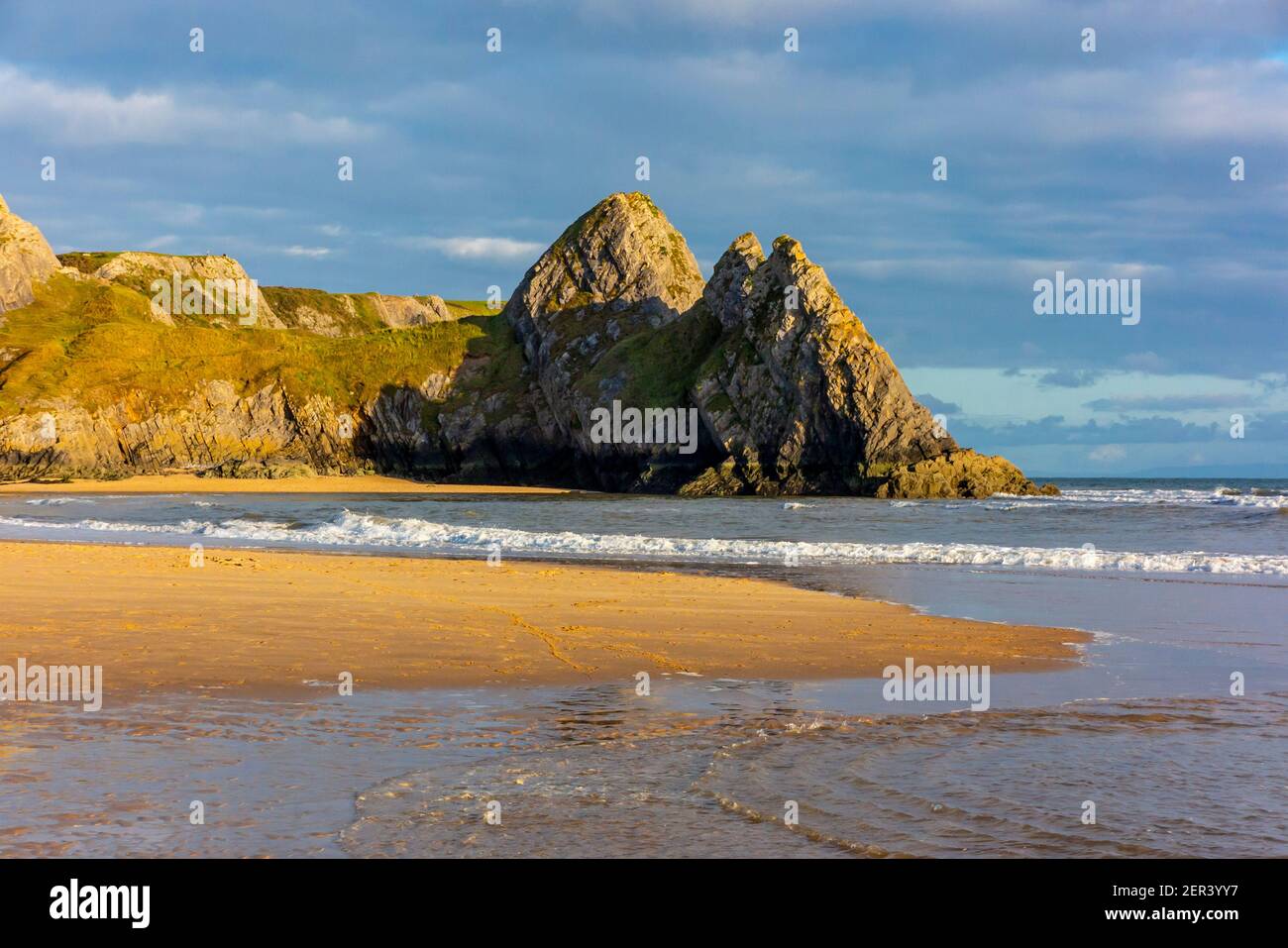 View of the sandy beach at Three Cliffs Bay on the south coast of the ...