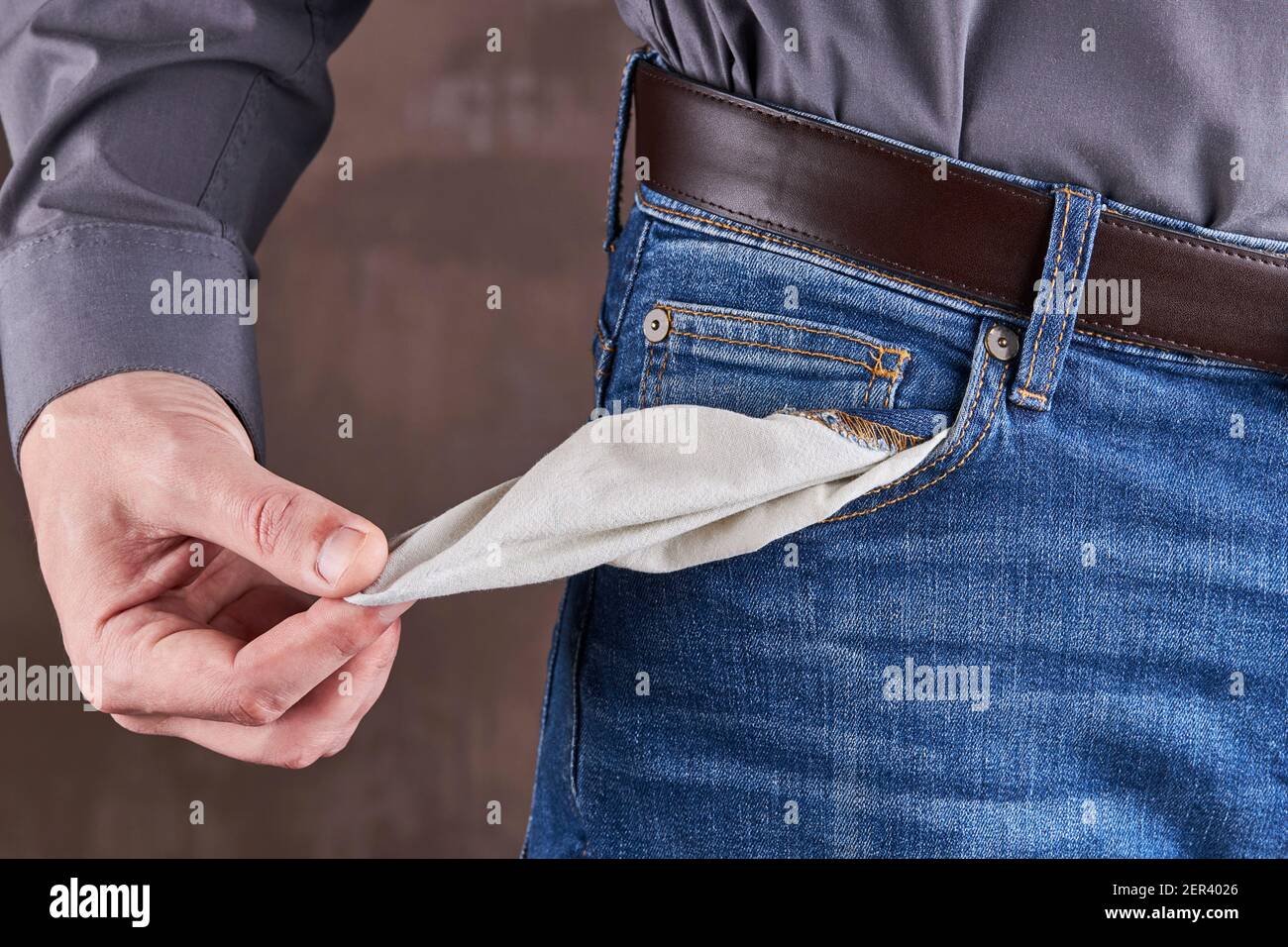 caucasian male person with empty jeans pocket. copy space. poverty and ...