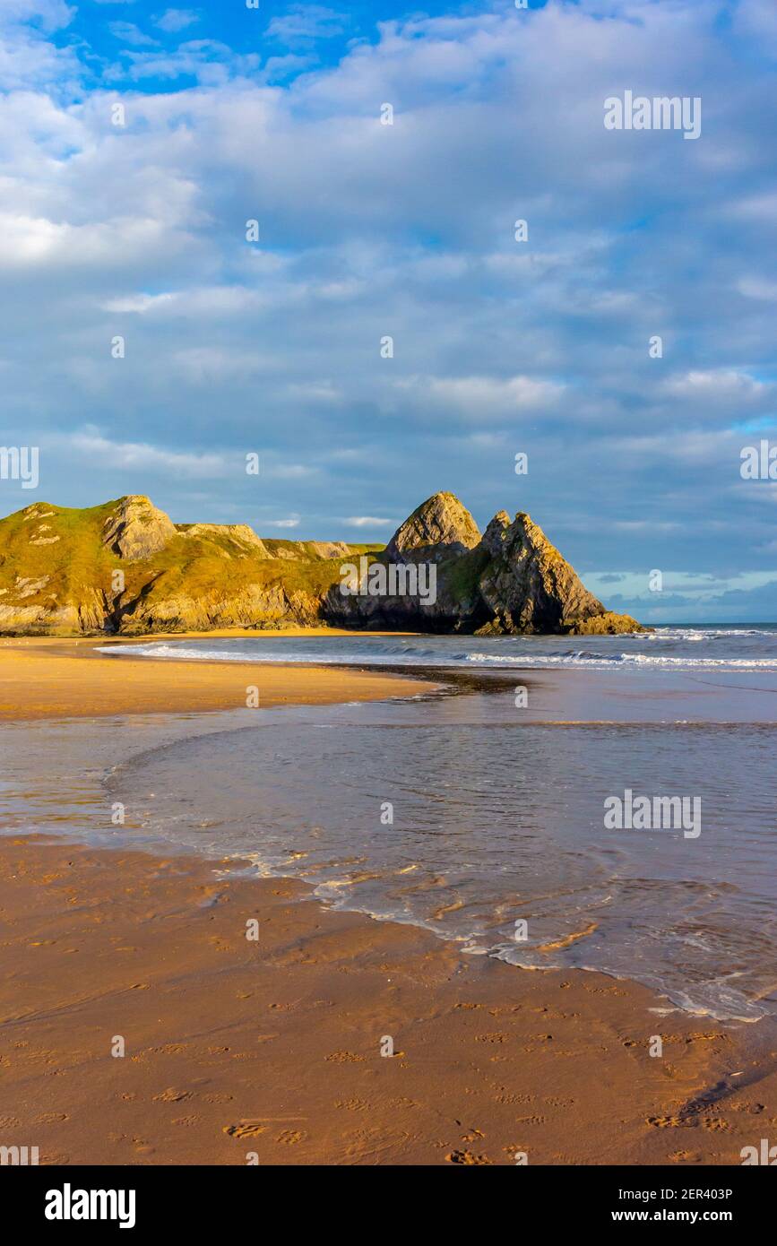 View of the sandy beach at Three Cliffs Bay on the south coast of the ...