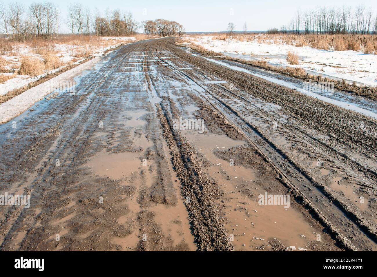 Dirty road in spring water snow spring Stock Photo - Alamy