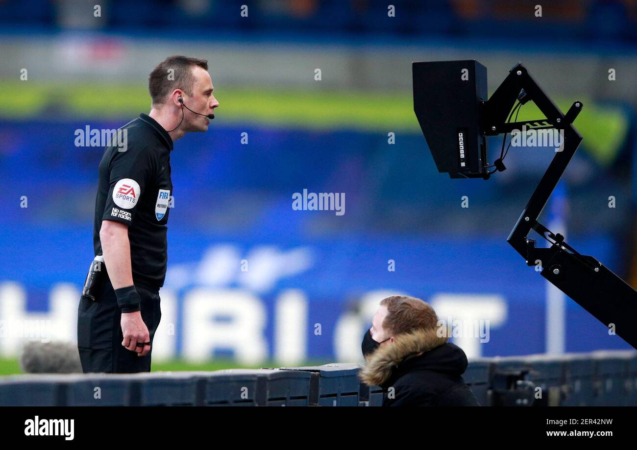 Referee Stuart Attwell checks the pitchside VAR screen during the ...