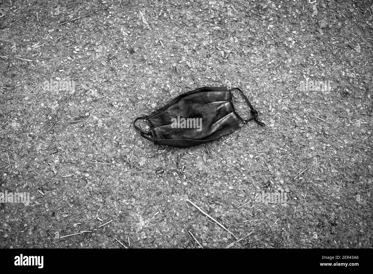 Discarded face mask dropped on the ground during the Covid-19 pandemic ...