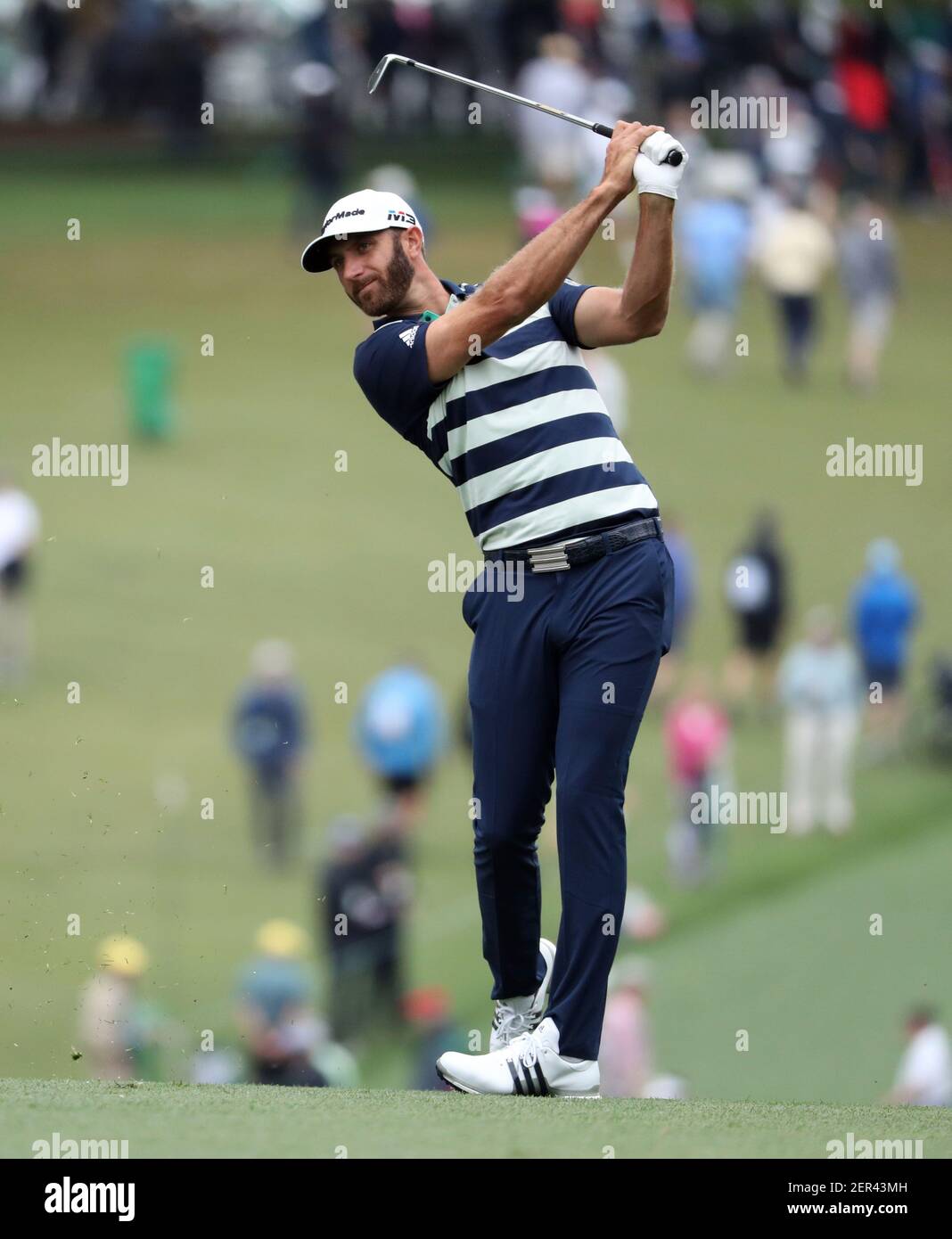 Dustin Johnson hits from the 1st fairway during the third round of the ...