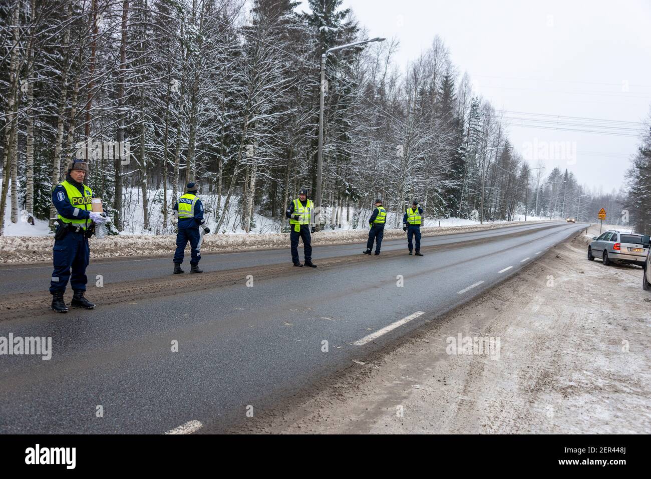 Finnish Police officers breathalysing drivers at random on a main road ...