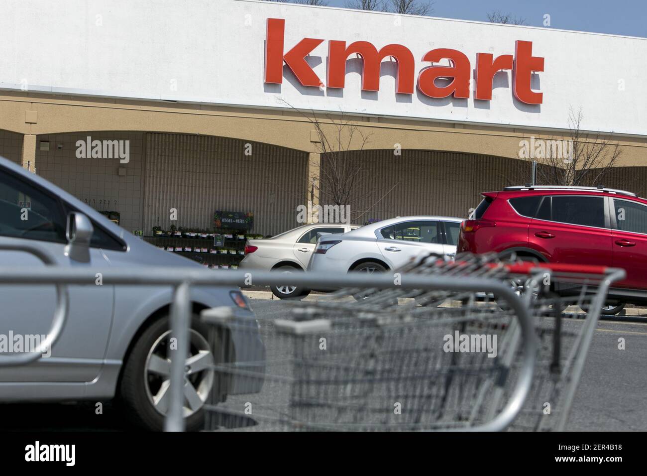 A logo sign outside of a Kmart retail store location in Silver Spring ...