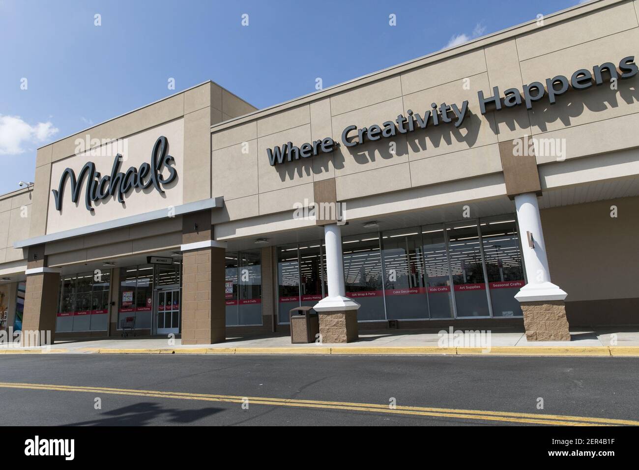 A logo sign outside of a Michaels retail store location in Silver ...