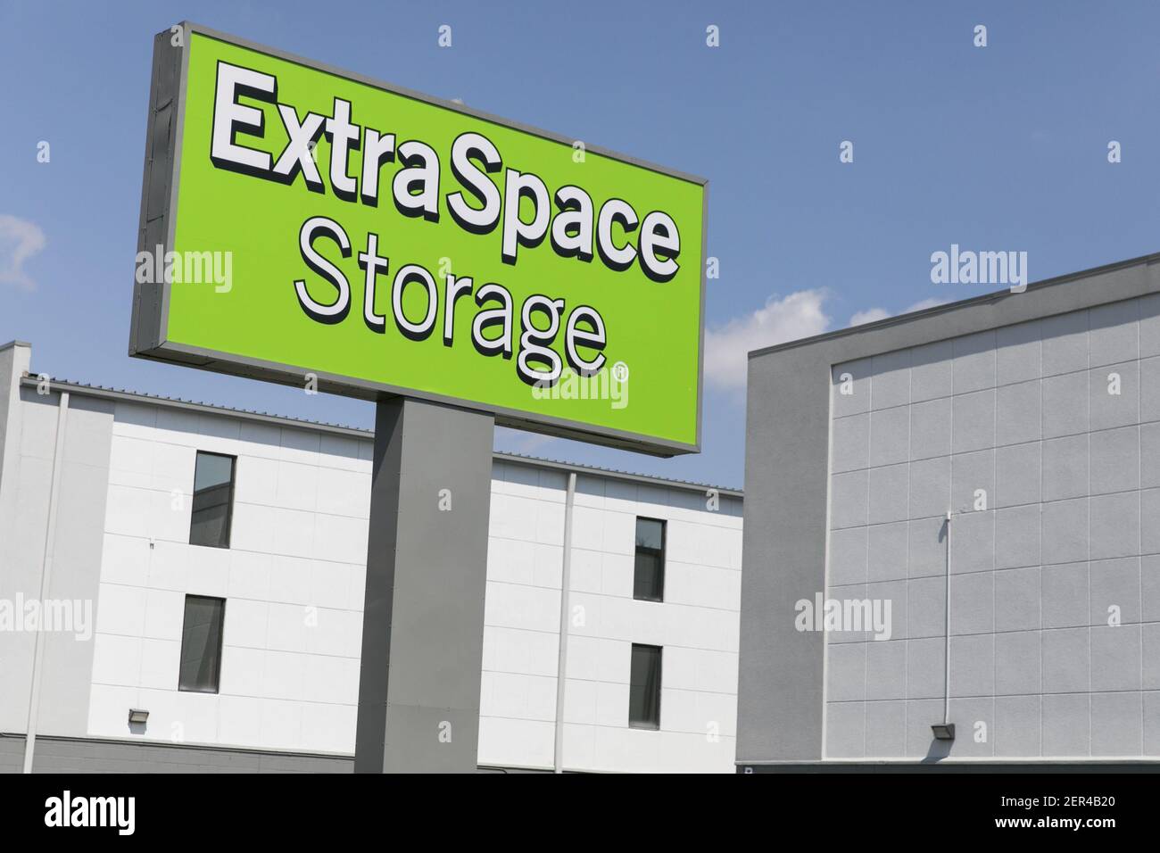A logo sign outside of a Extra Space Storage location in Wheaton ...