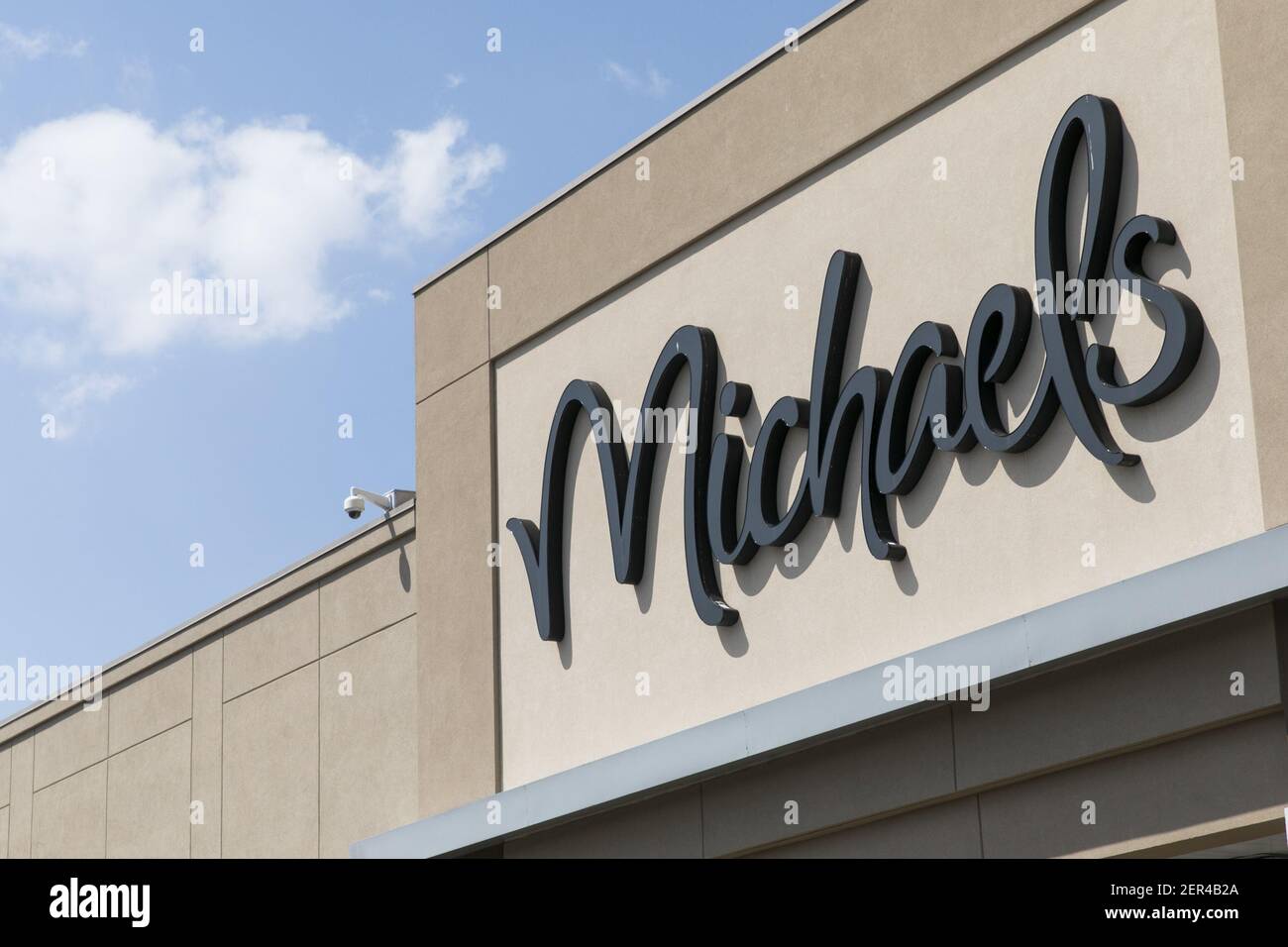 A logo sign outside of a Michaels retail store location in Silver ...