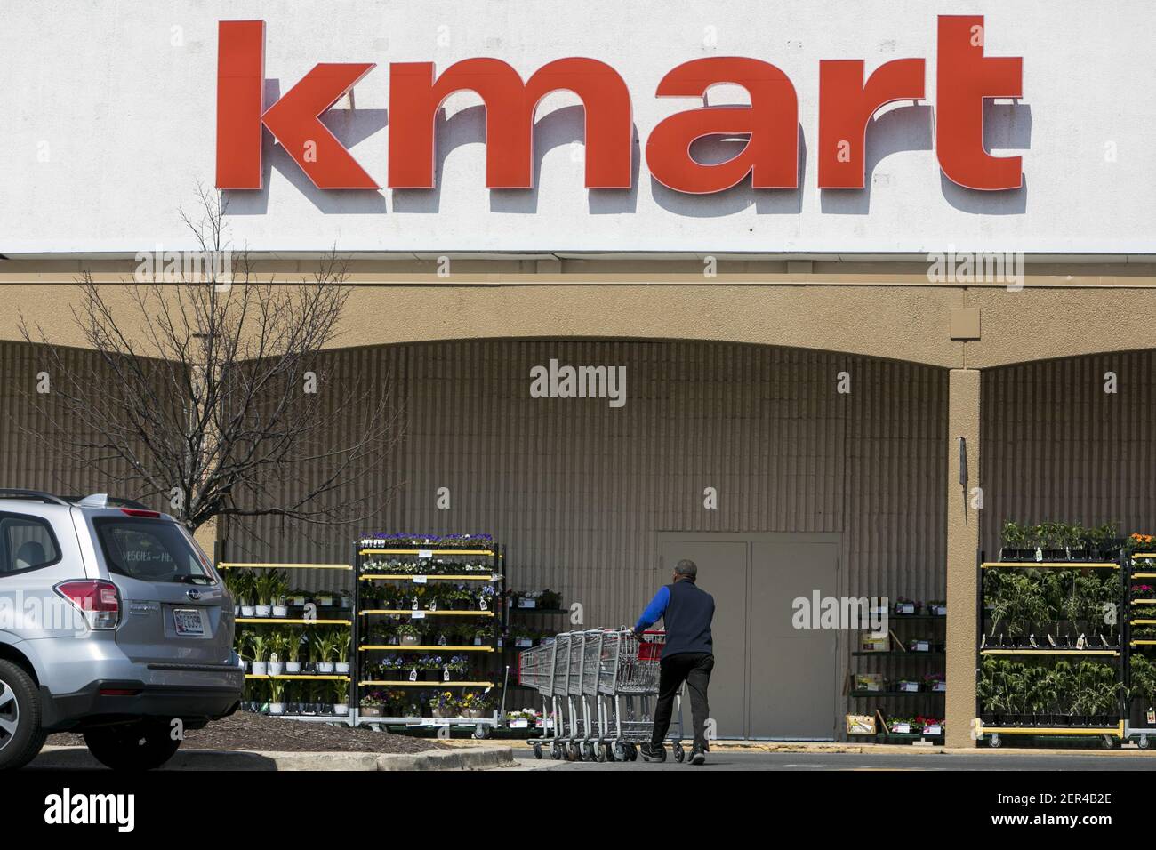 A logo sign outside of a Kmart retail store location in Silver Spring ...