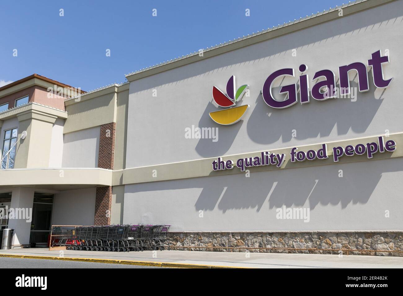 A logo sign outside of a Giant Food grocery retail store location in ...