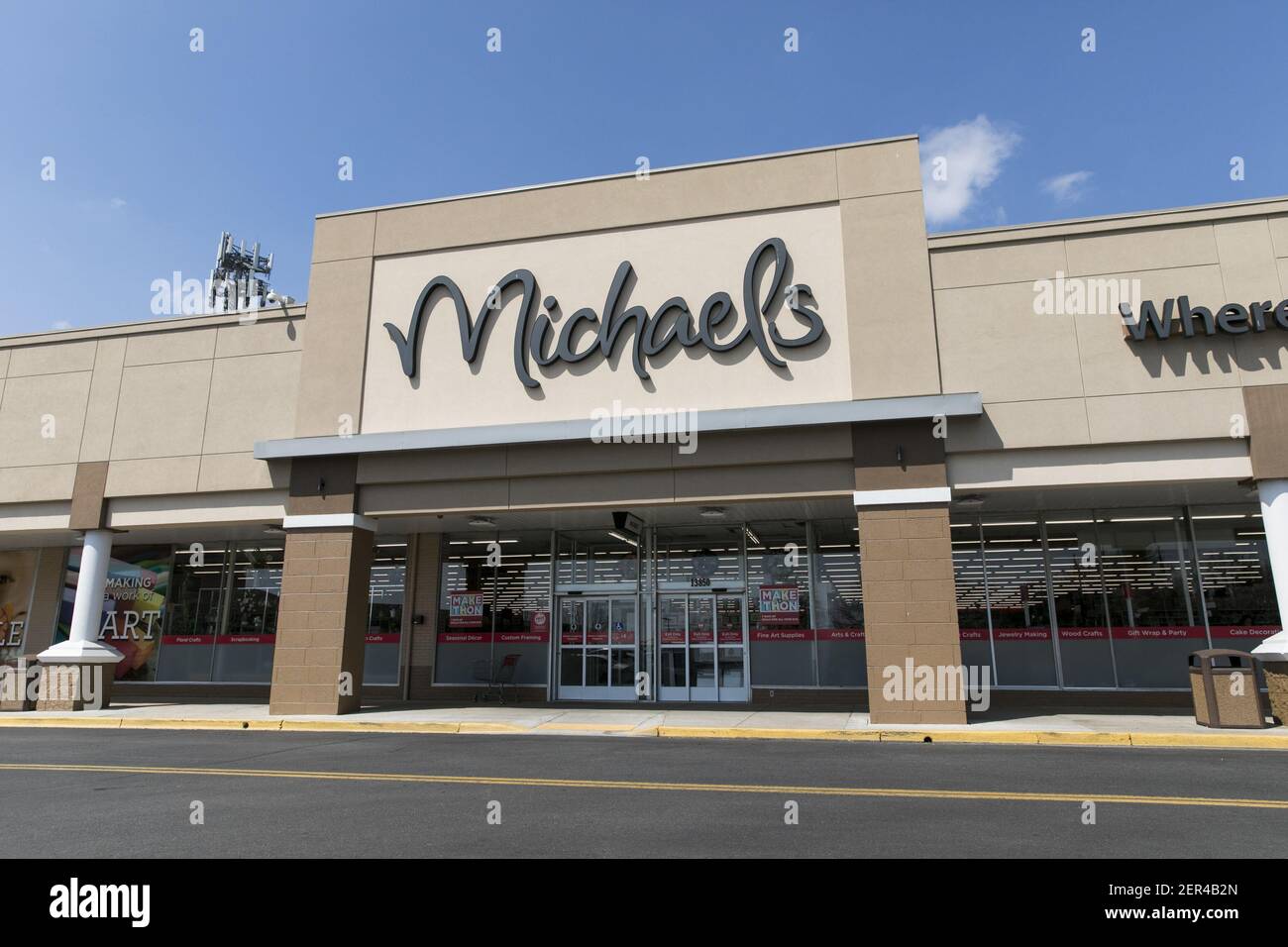 A logo sign outside of a Michaels retail store location in Silver ...