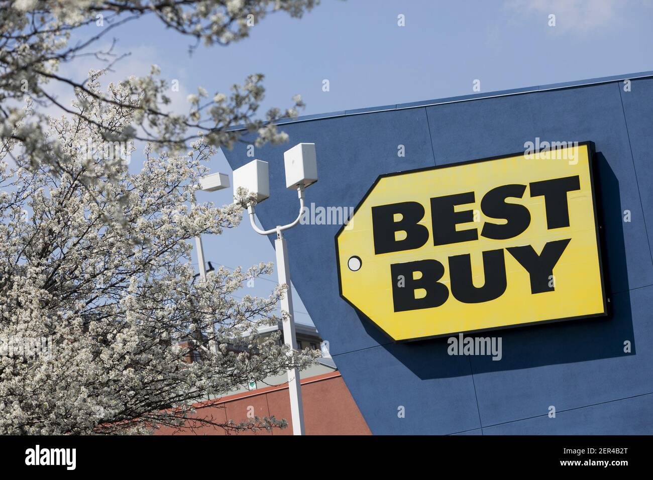 A logo sign outside of a Best Buy retail store location in Wheaton ...