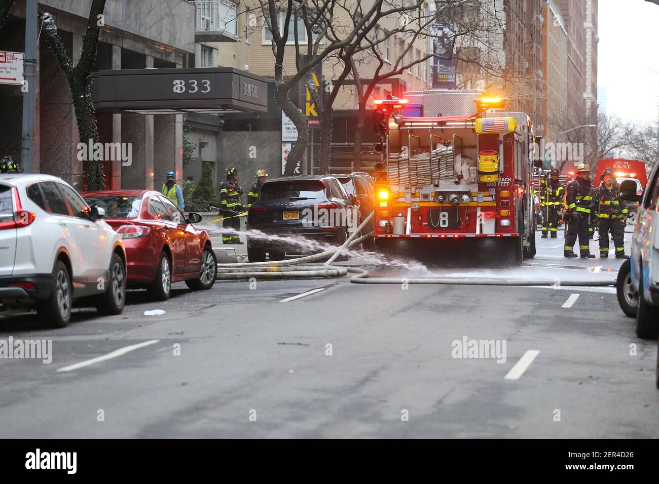 First responders gather at a manhole explosion in midtown Manhattan in ...
