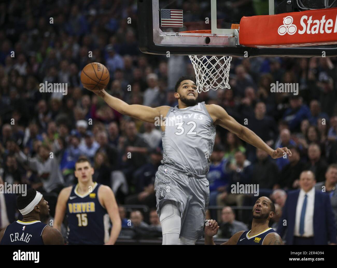 The Minnesota Timberwolves' Karl-Anthony Towns dunks against the Denver ...