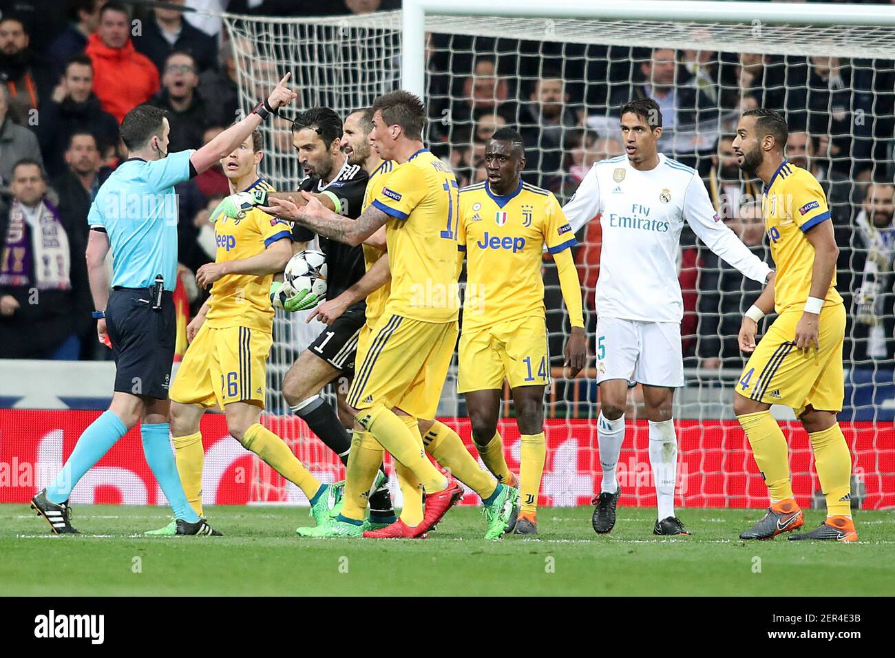 Gianluigi Buffon and Juventus Football Club's players have words with English referee Michael ...