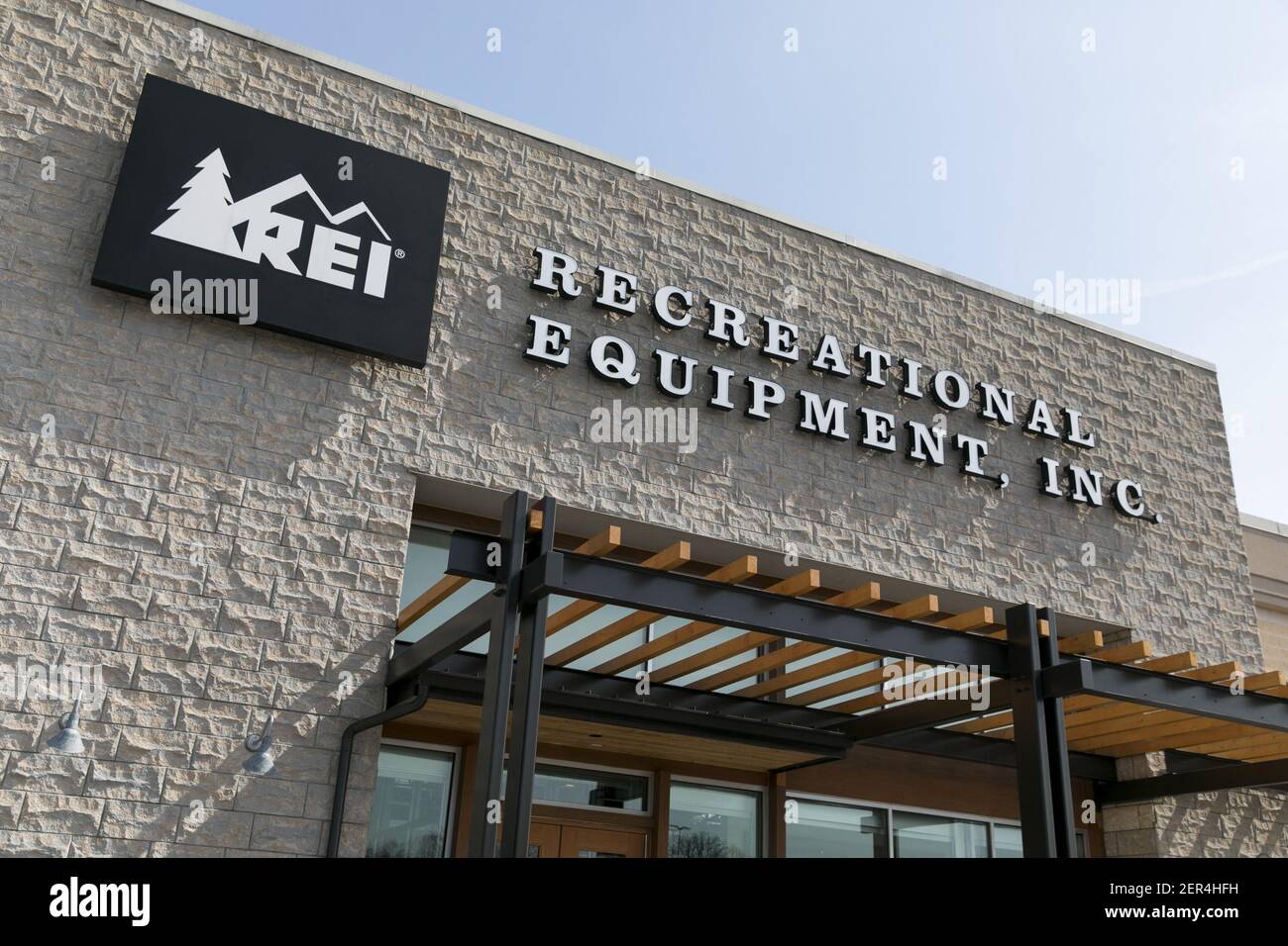 A logo sign outside of a Recreational Equipment, Inc., commonly known ...