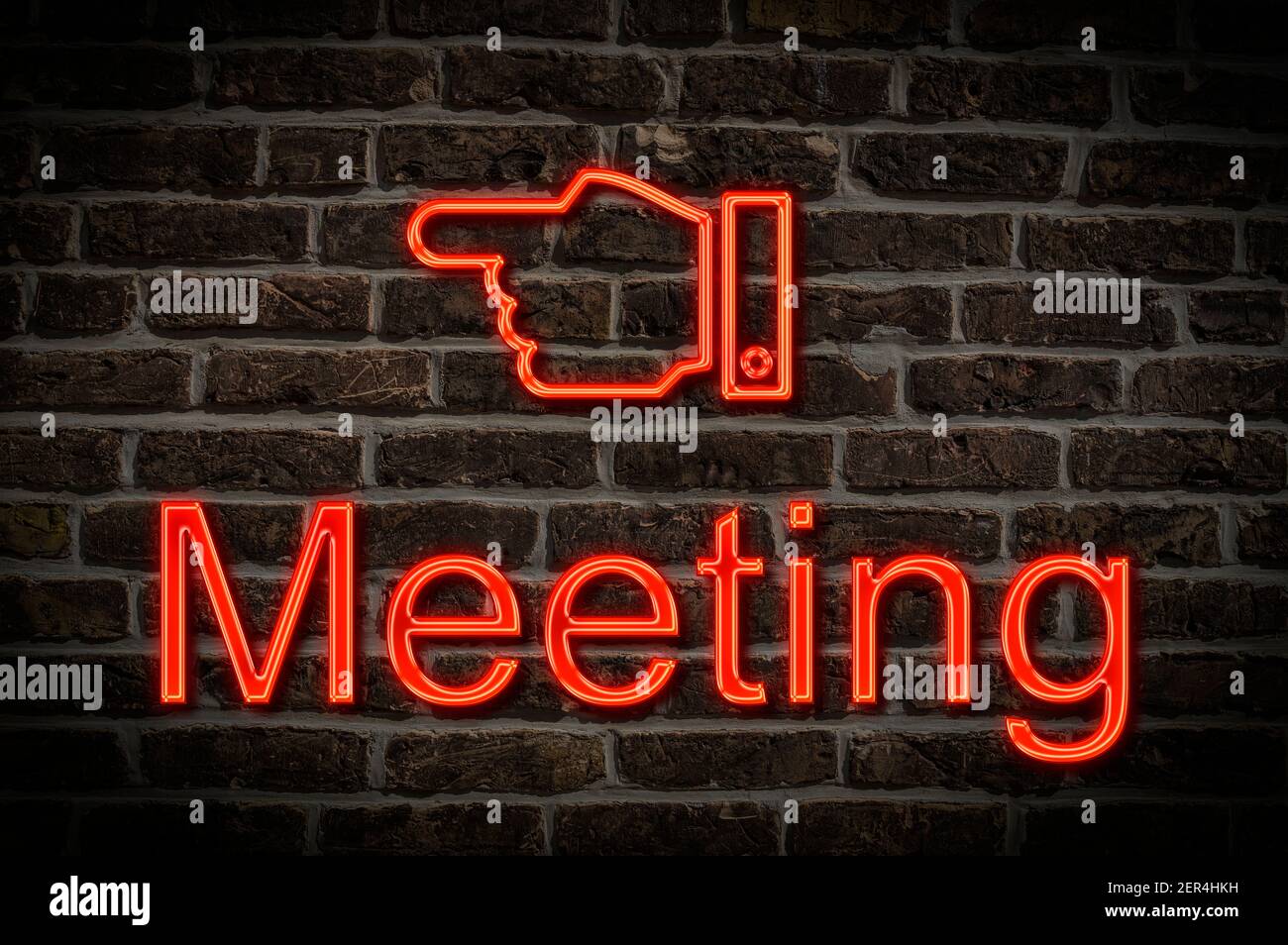 Detail photo of a neon sign on a wall with the inscription Meeting ...