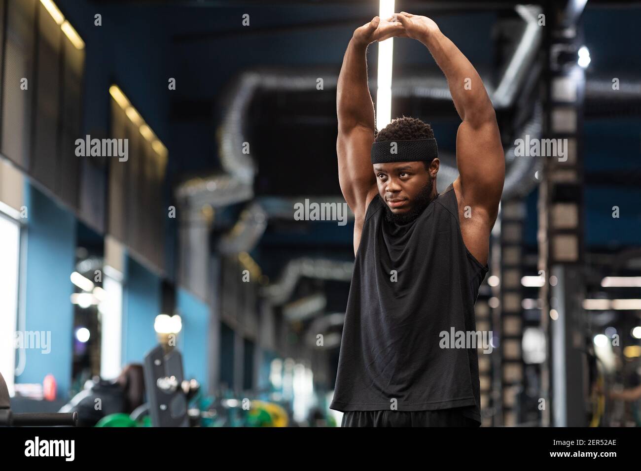 Muscular african american man bodybuilder doing workout at gym Stock ...