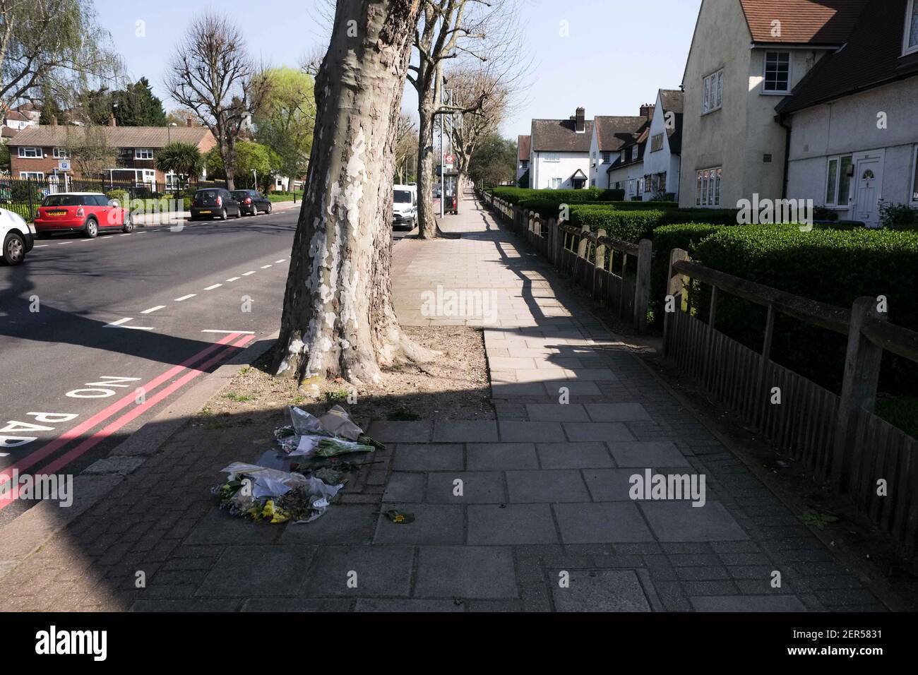Floral tributes are left on the memorial stone of Stephen Lawrence on ...