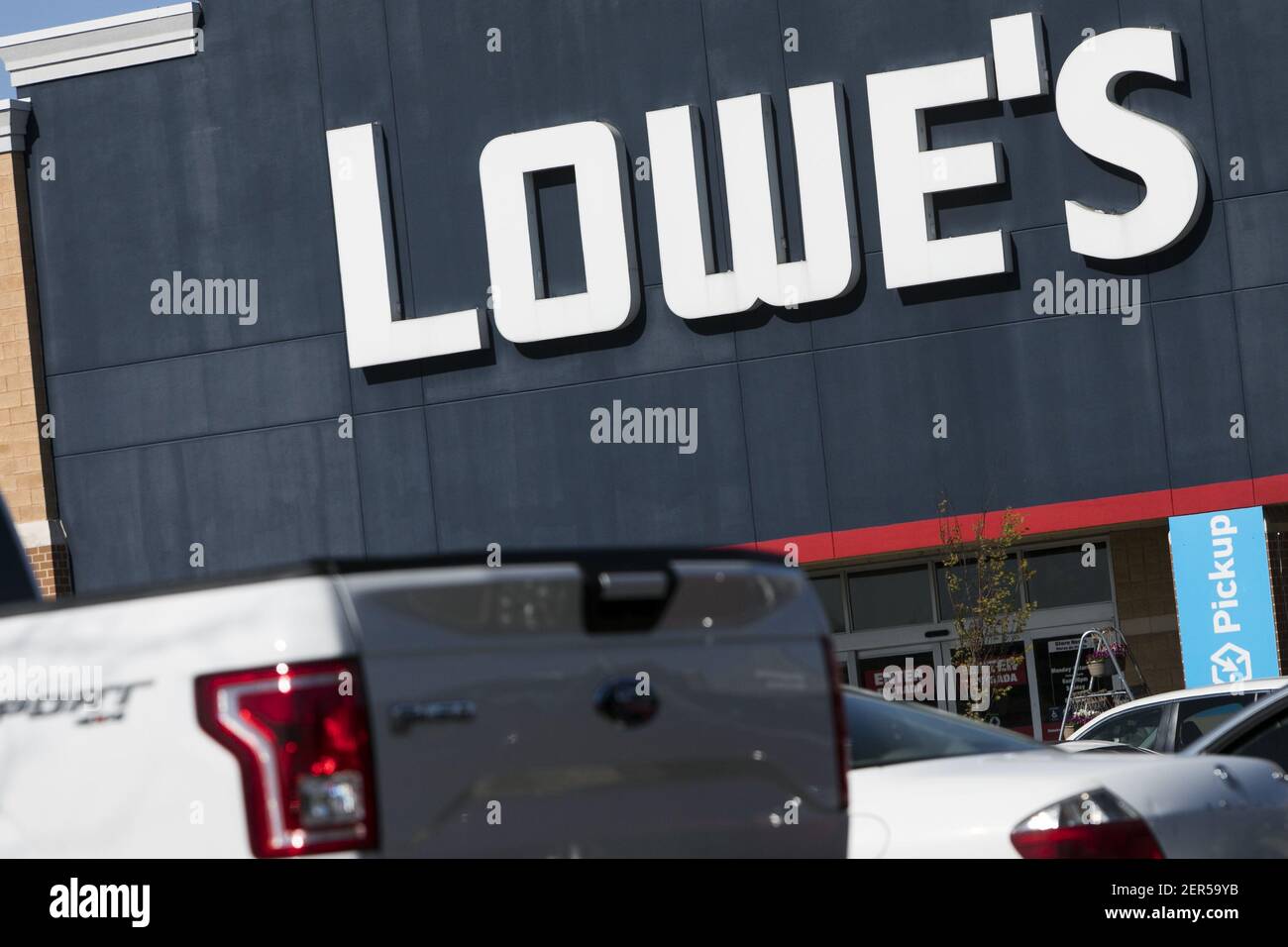A logo sign outside of a Lowe's retail store location in Elkridge ...