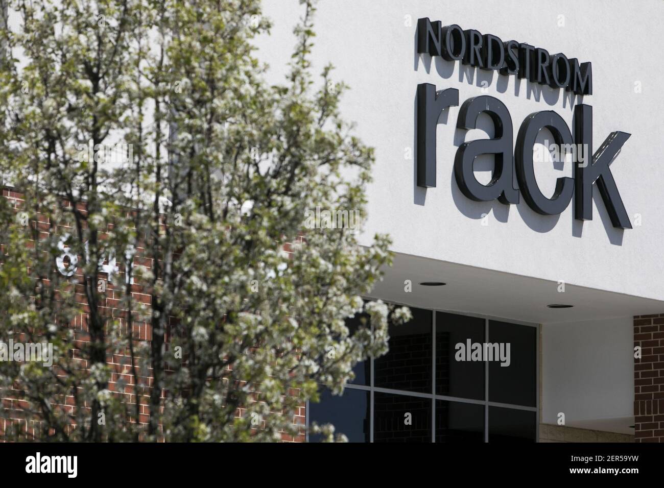 A logo sign outside of a Nordstrom Rack retail store location in ...