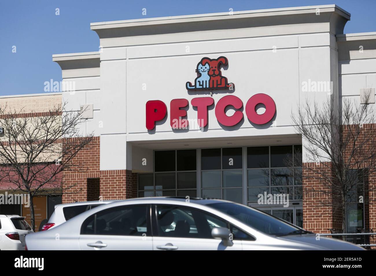 A logo sign outside of a Petco retail store location in Columbia ...