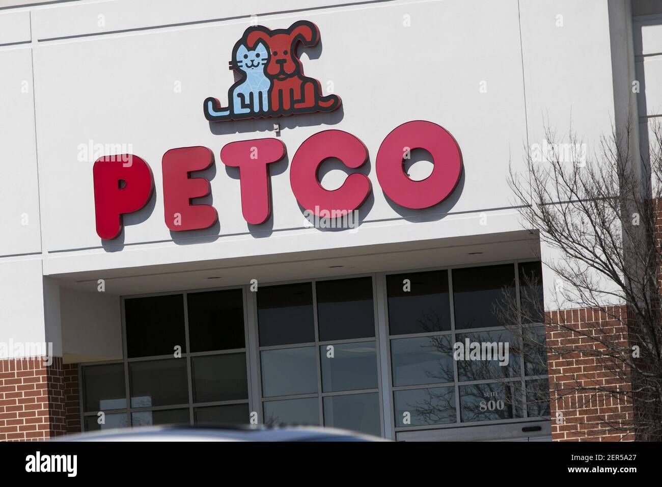 A logo sign outside of a Petco retail store location in Columbia ...