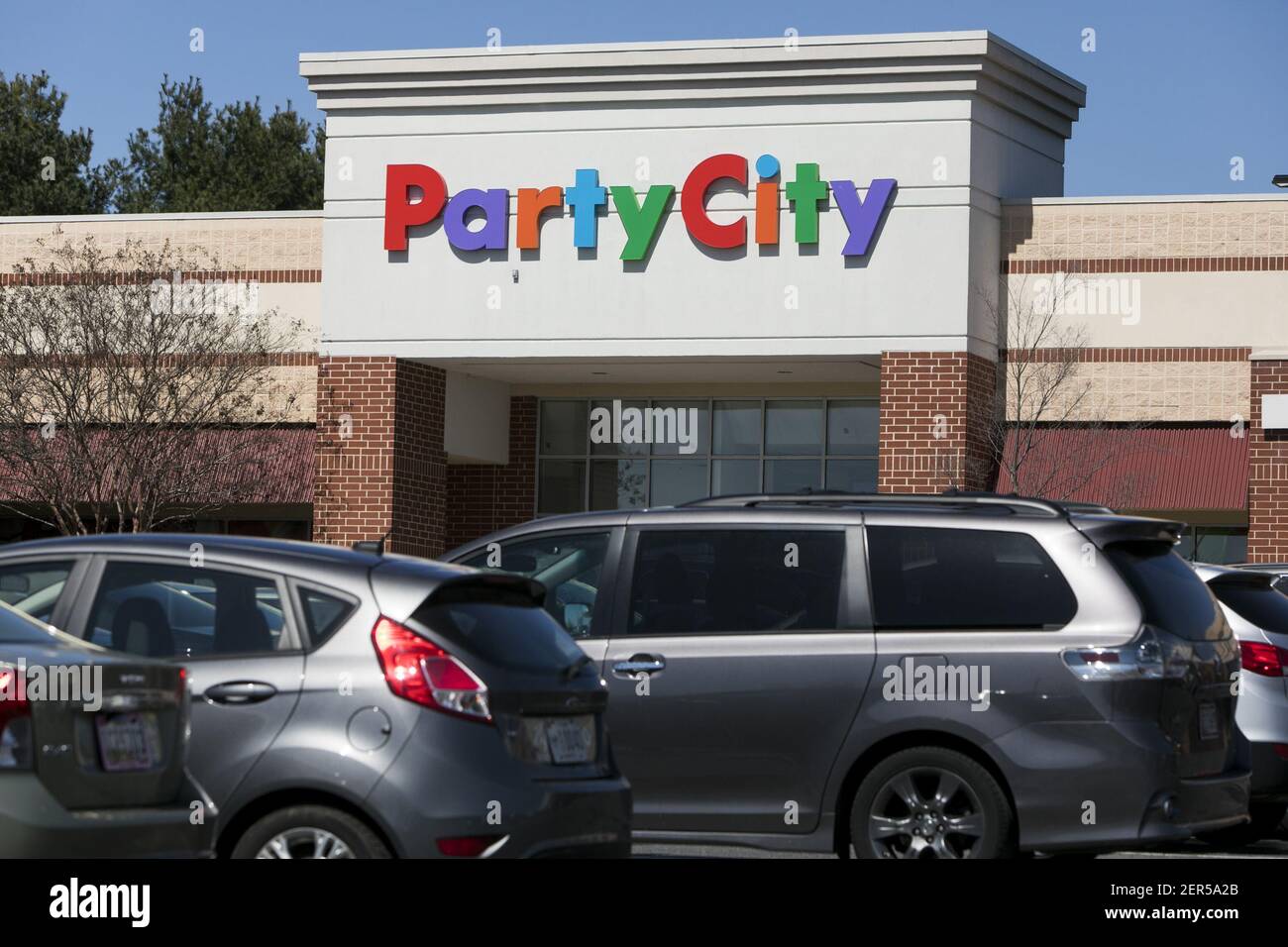 A logo sign outside of a Party City retail store location in Columbia ...