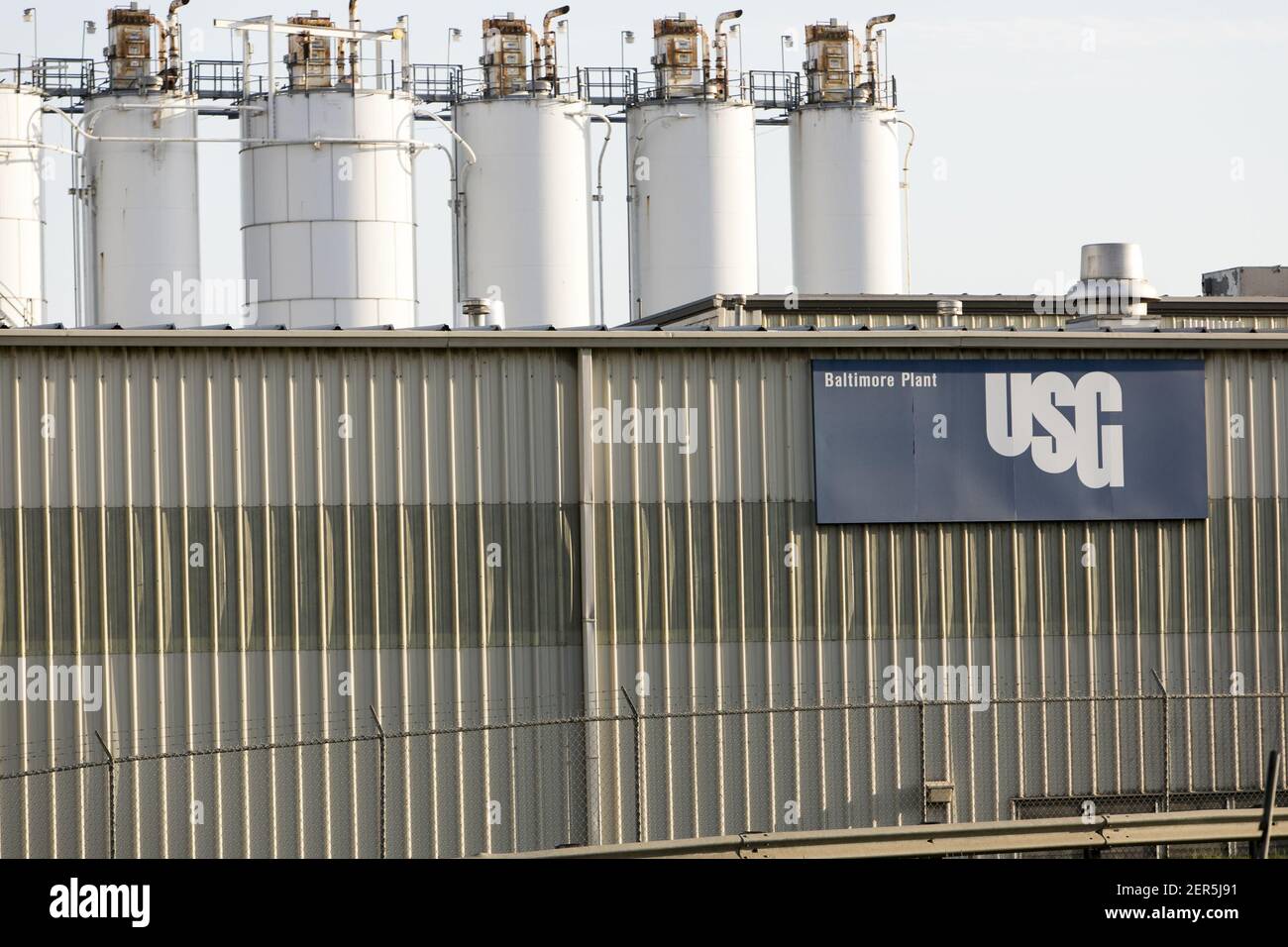 A logo sign outside of a facility occupied by the USG Corporation, also ...