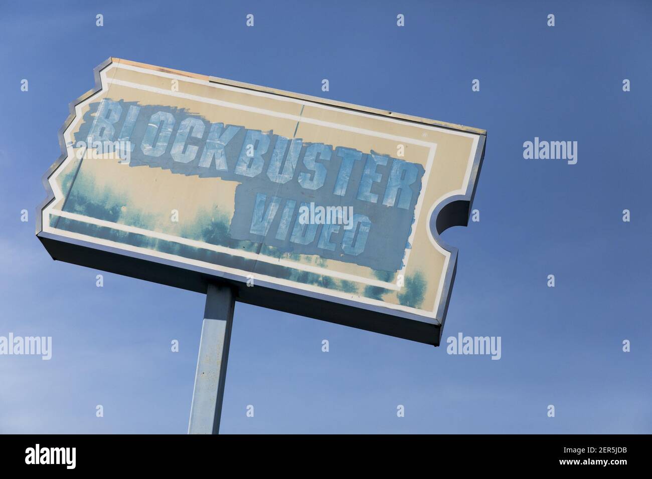 A painted over logo sign of a long closed Blockbuster Video store in ...