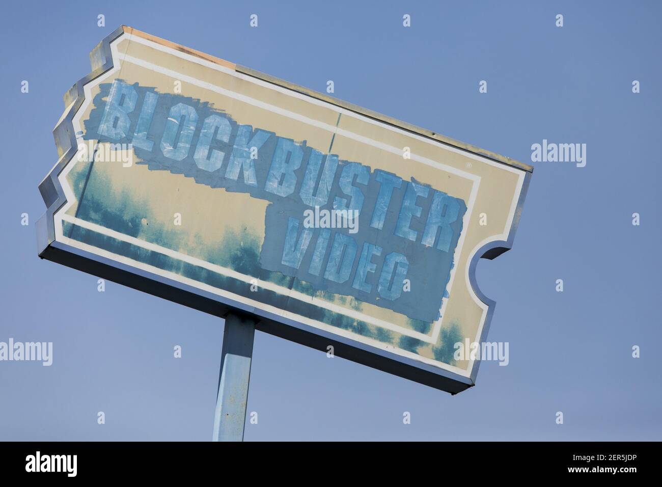 A painted over logo sign of a long closed Blockbuster Video store in ...