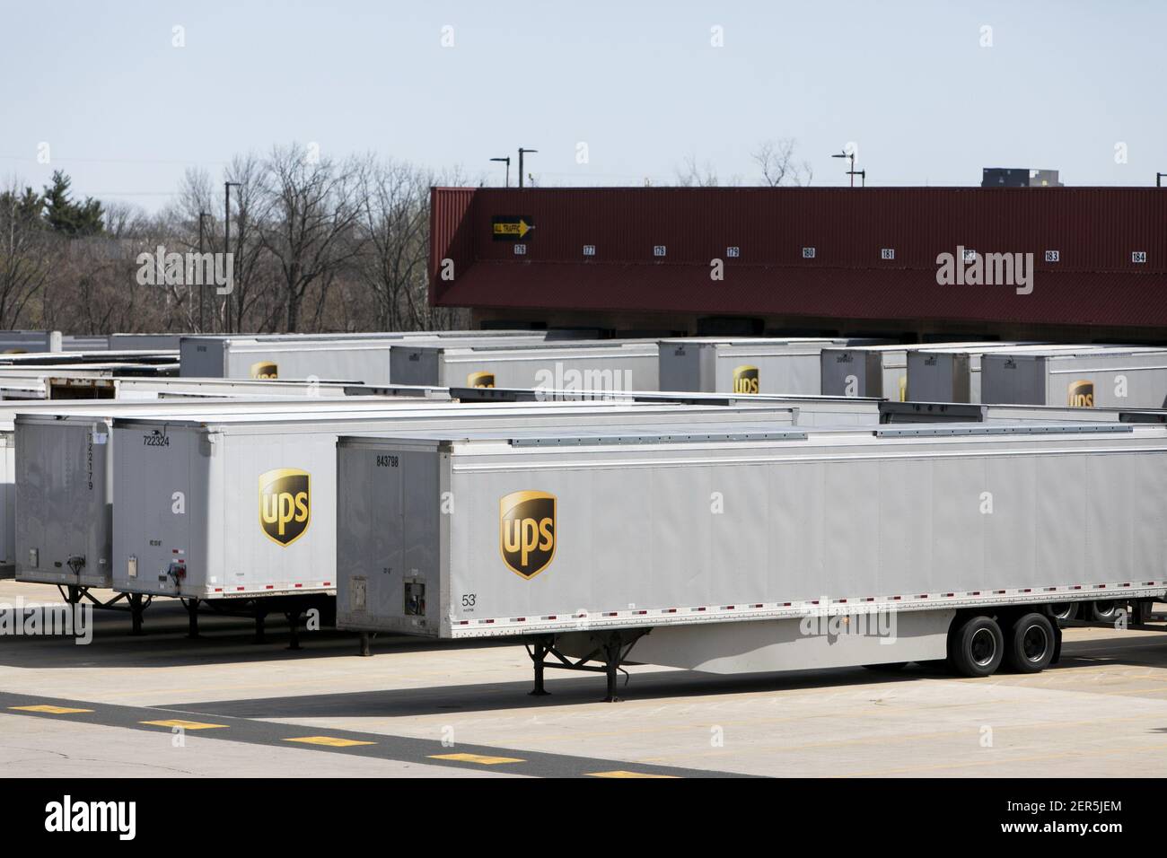 Delivery trucks and trailers at at UPS (United Parcel Service) facility ...